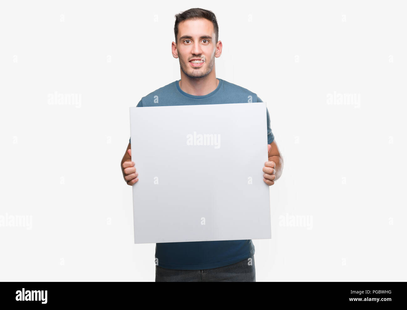Handsome young man holding advertising banner with a happy face ...