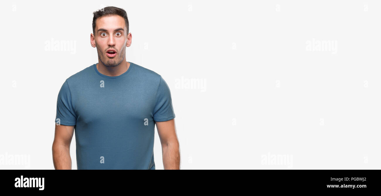 Handsome young casual man afraid and shocked with surprise expression ...