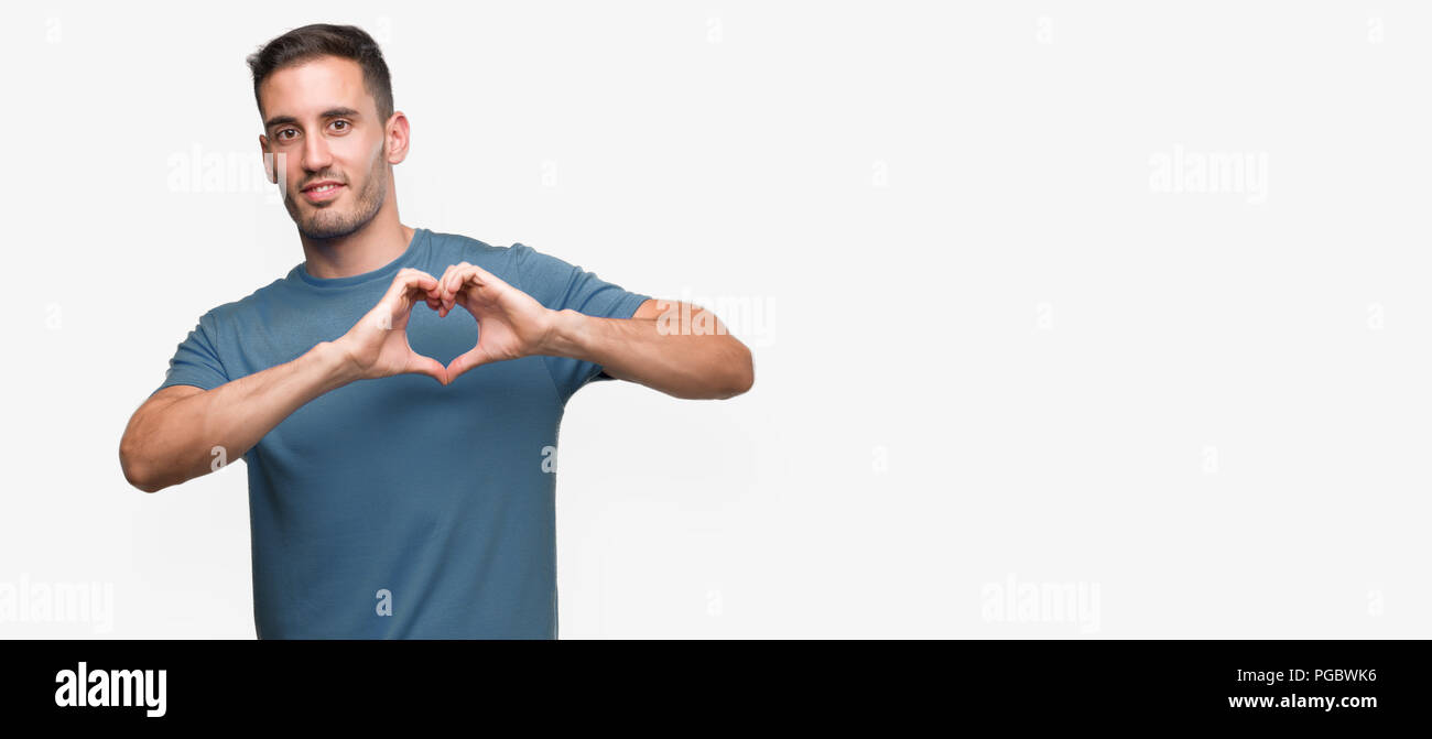Handsome young casual man smiling in love showing heart symbol and ...