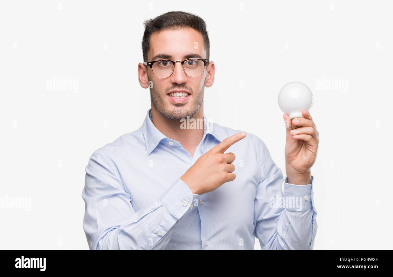 Man pointing at lightbulb hi-res stock photography and images - Alamy