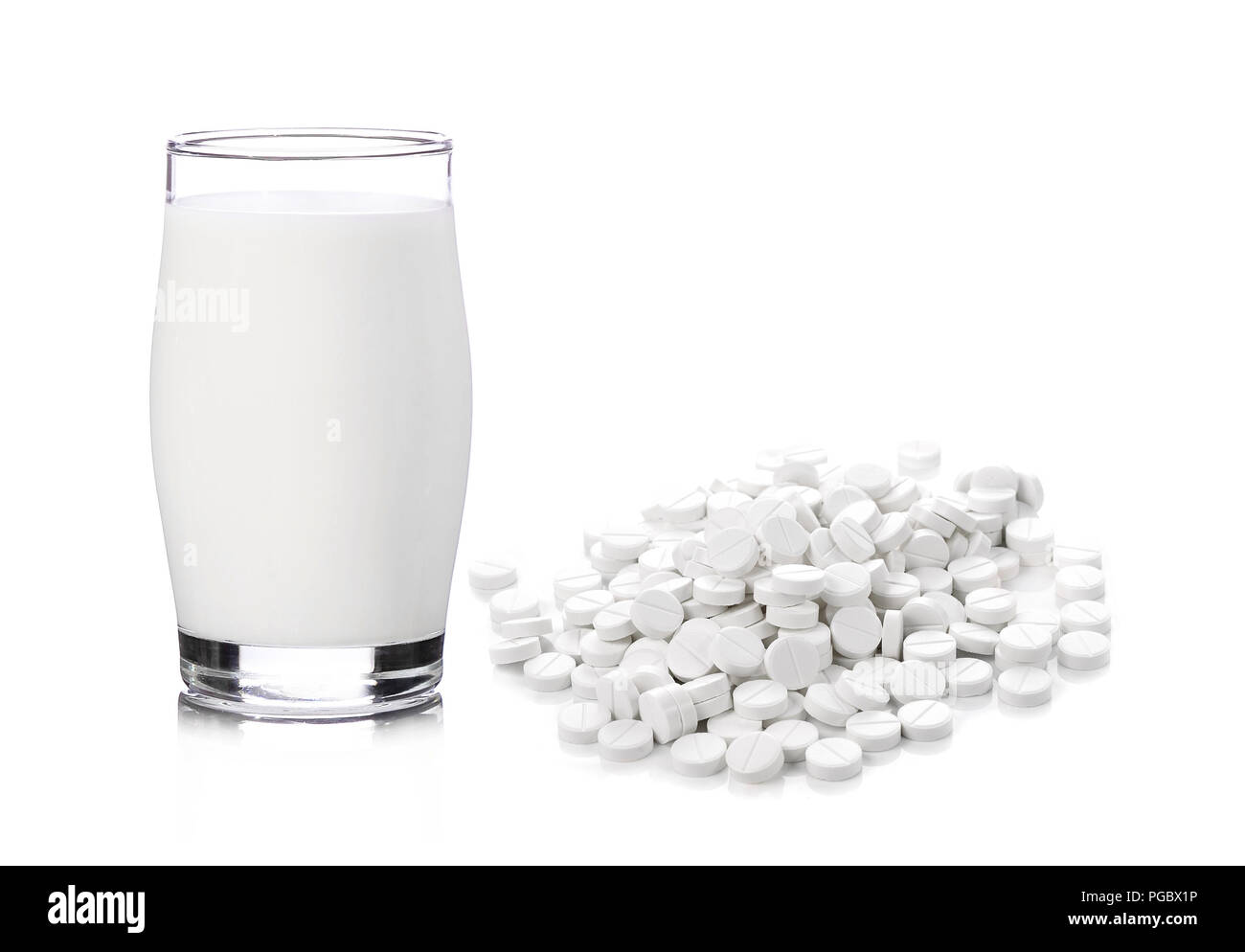 pill and glass of milk isolated on white background Stock Photo - Alamy