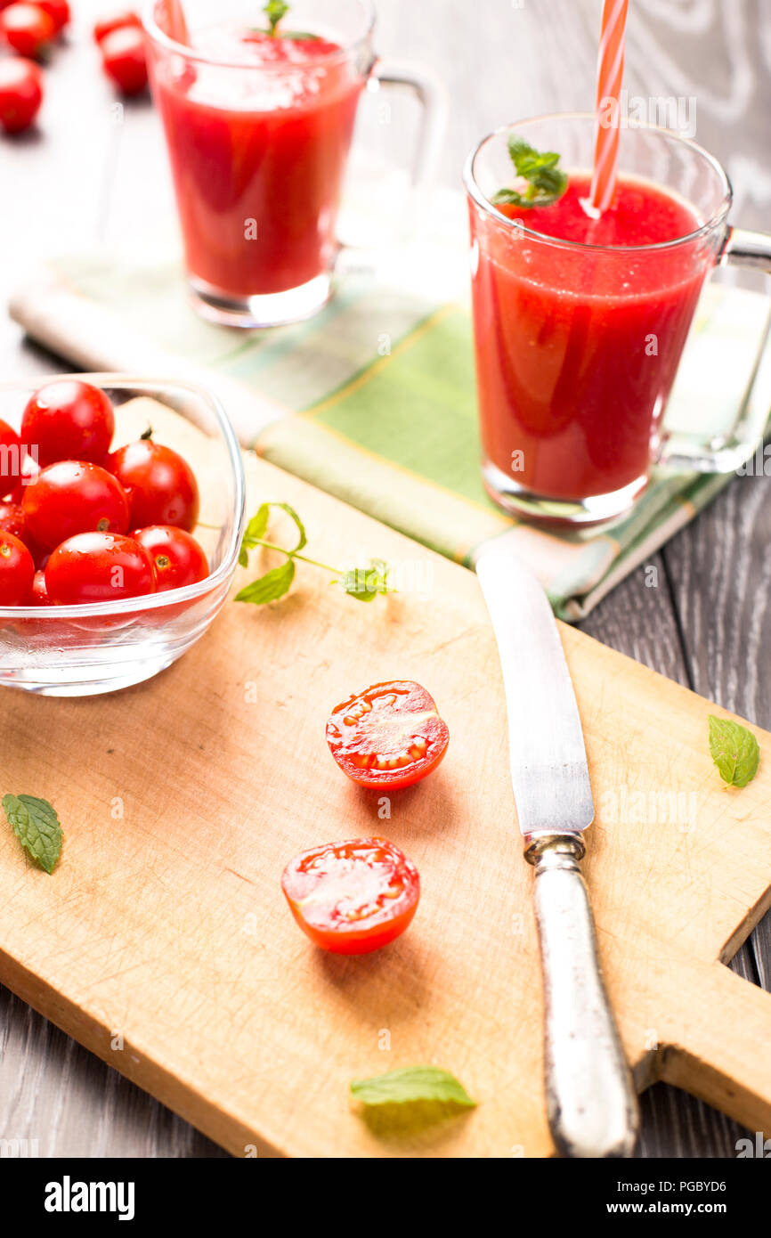 Natural drink of tomato juice on the table Stock Photo - Alamy
