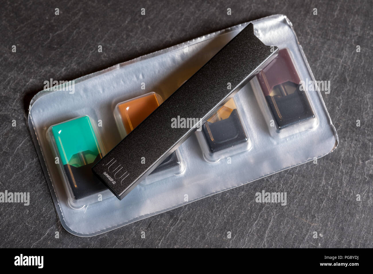 JUUL nicotine vapor dispenser and Pods on slate Stock Photo - Alamy