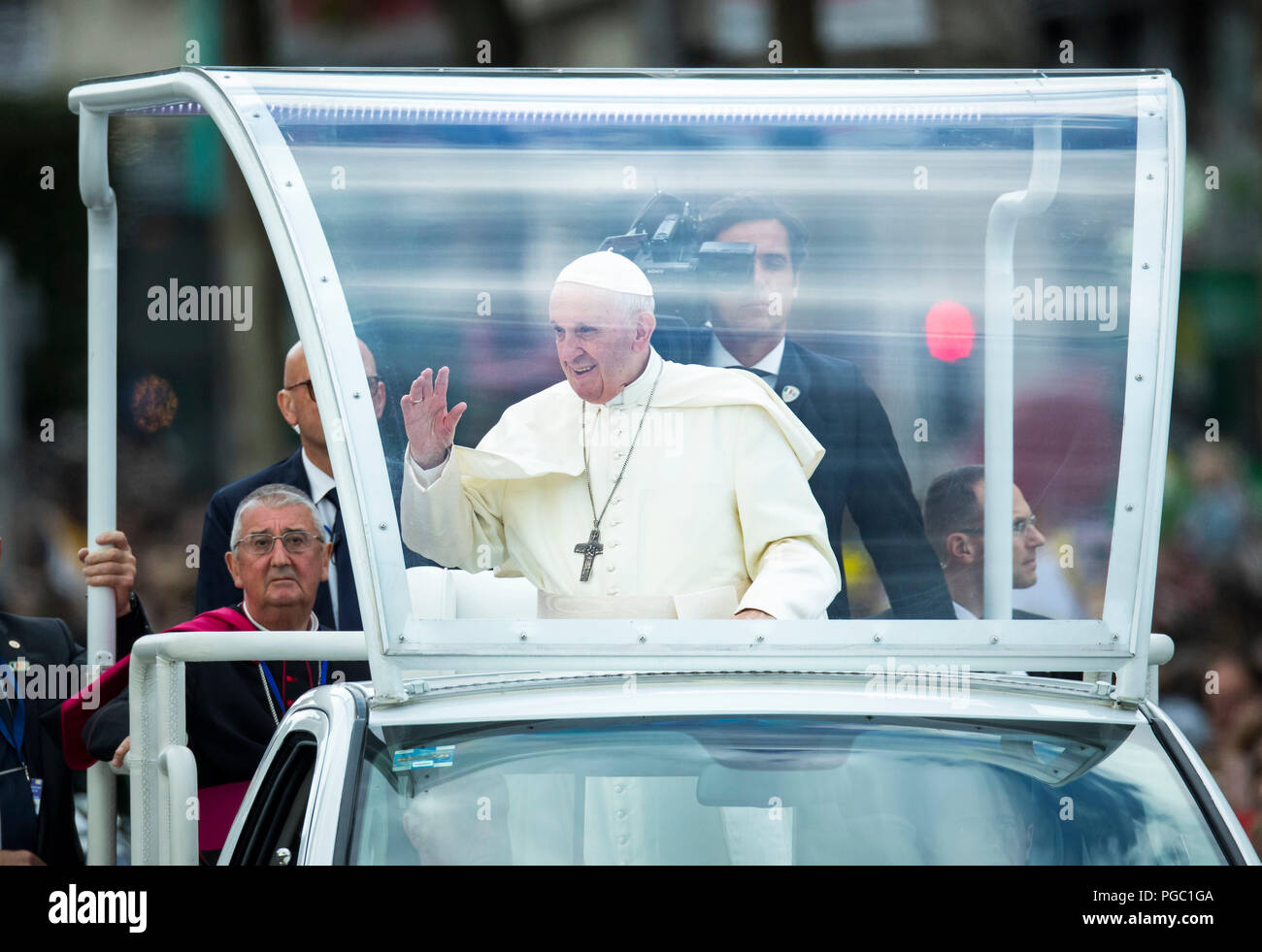 Pope Francis waves to the waiting crowds on O'Connell Street, Dublin as ...