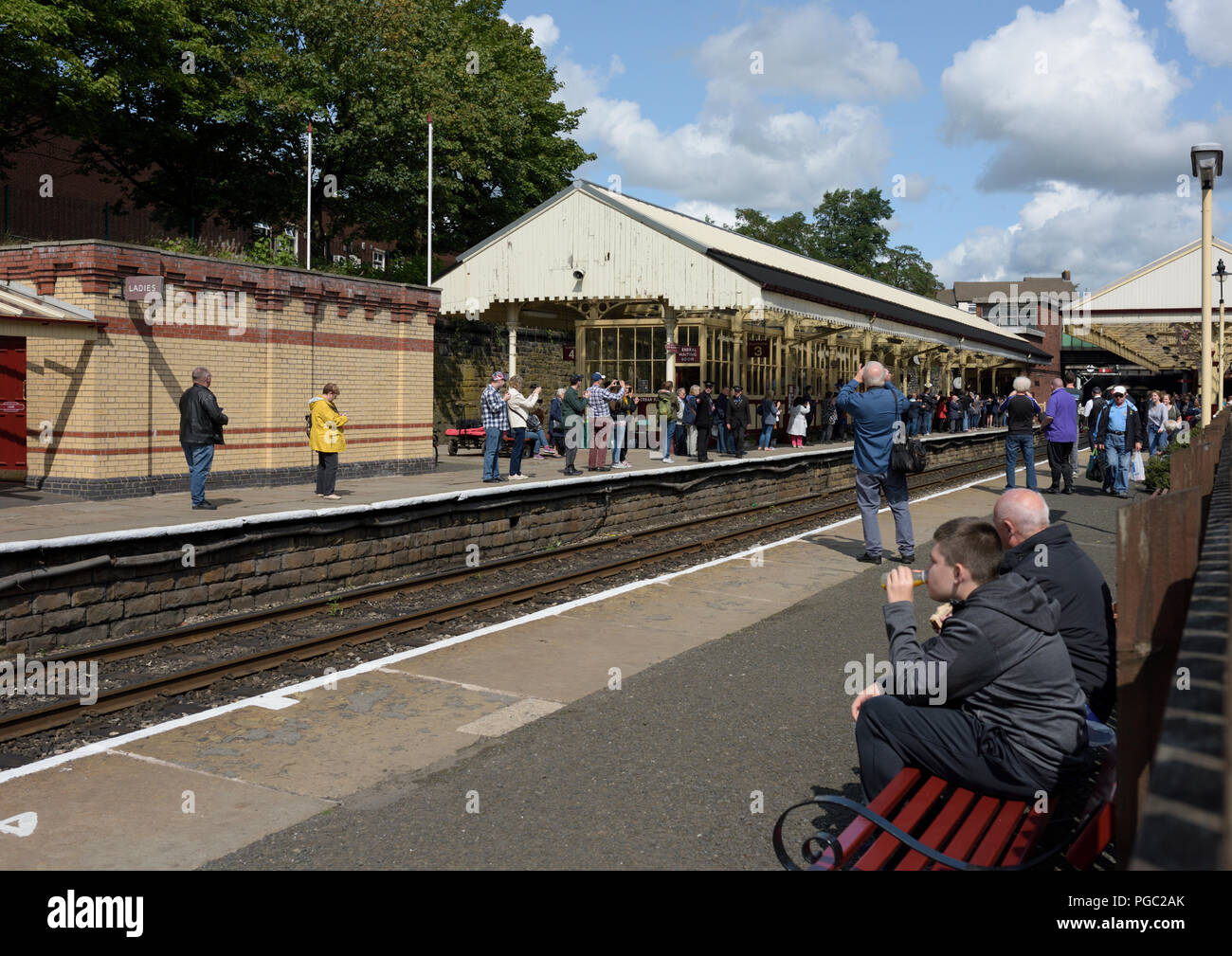 Passengers waiting for flying scotsman steam locomotive on bury railway ...