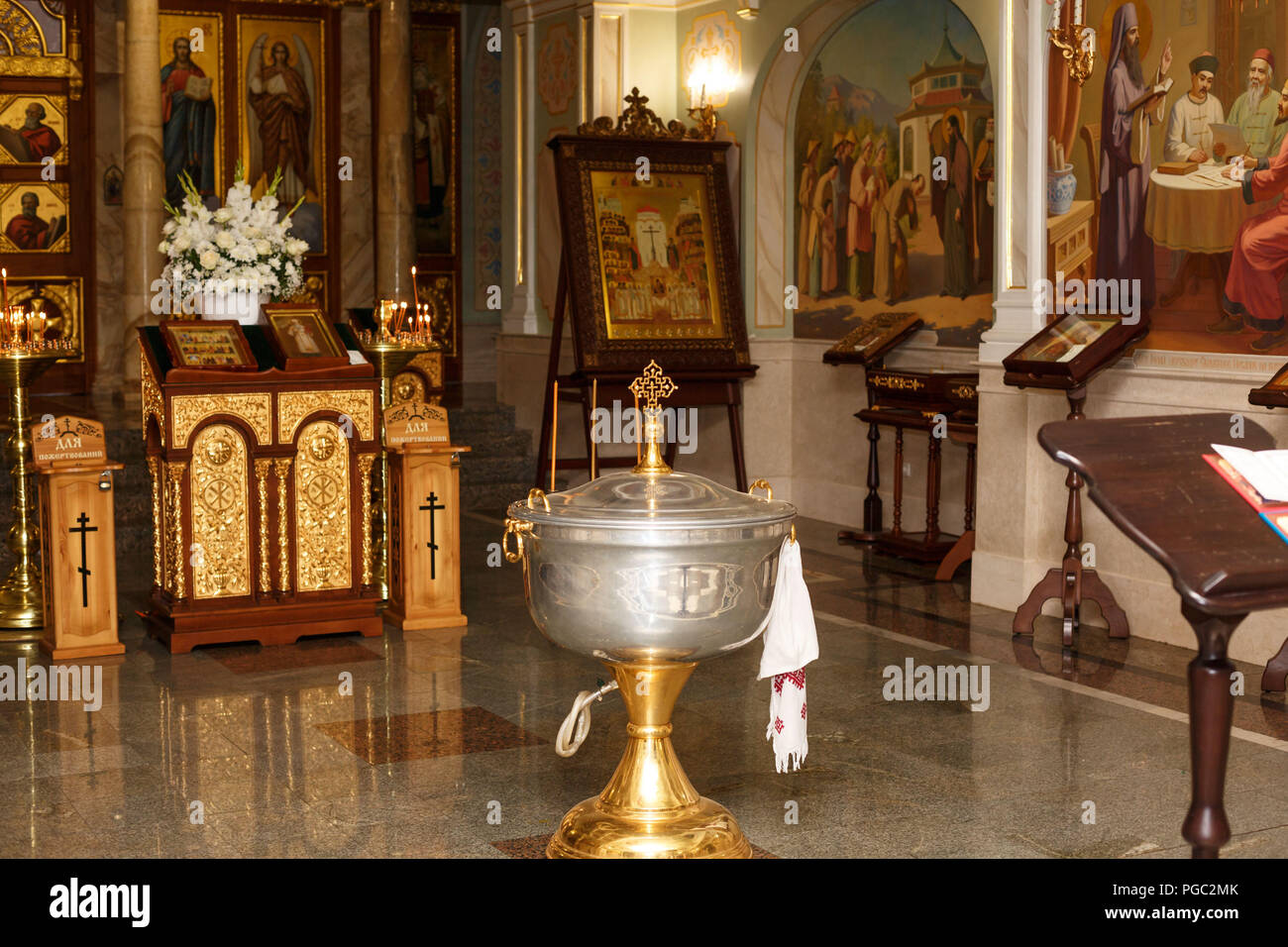Orthodox Church candles with icons, the Bible and the cross Stock Photo ...