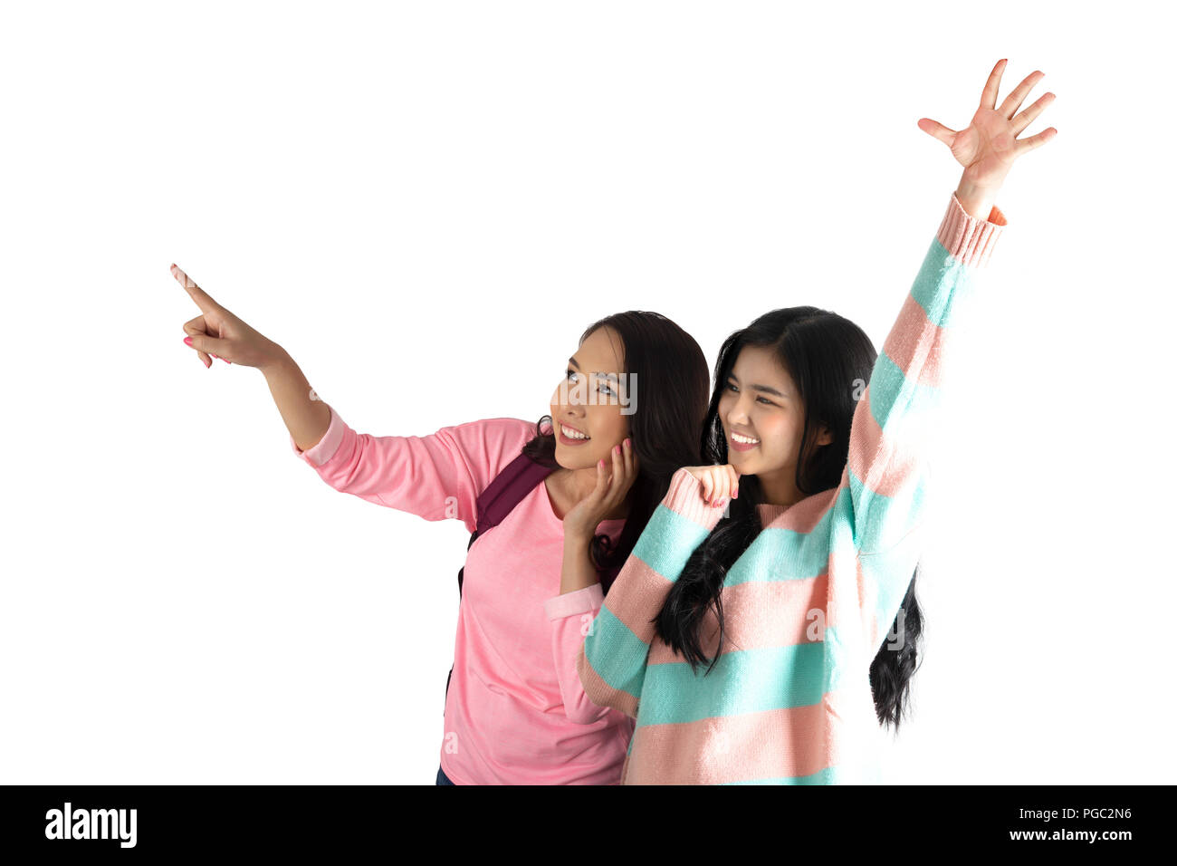Two cute asian girls in happy movement on white background Stock Photo ...