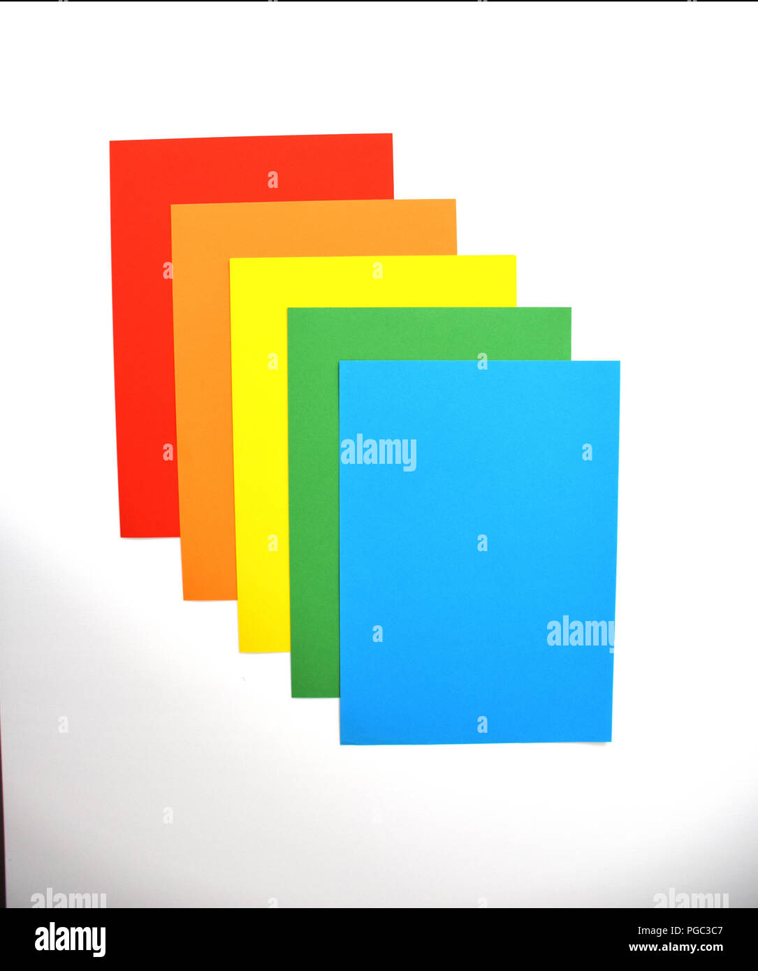 Colored a4 sheets on white background blue color Stock Photo - Alamy