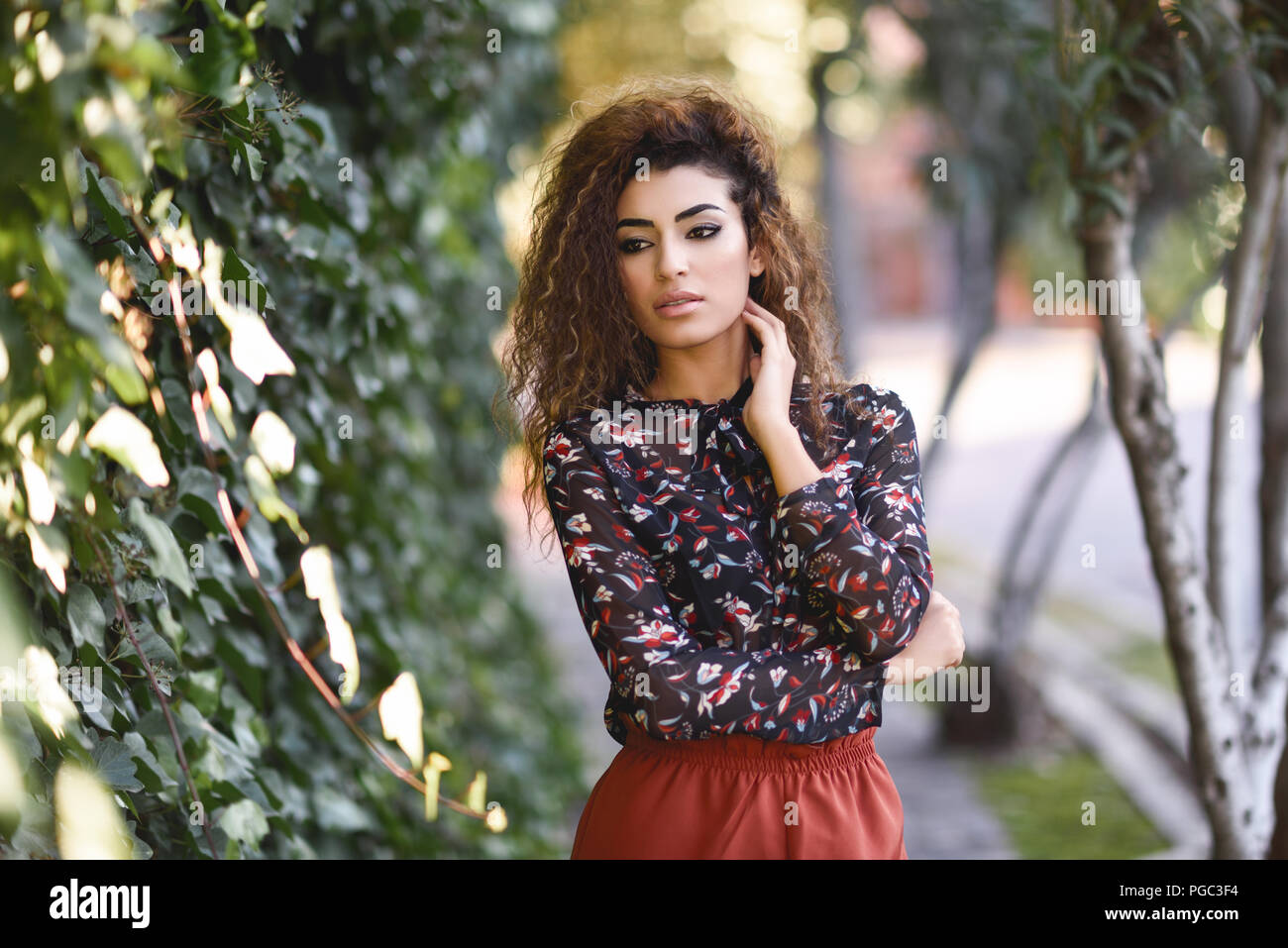 Beautiful young arabic woman with black curly hairstyle. Arab girl ...