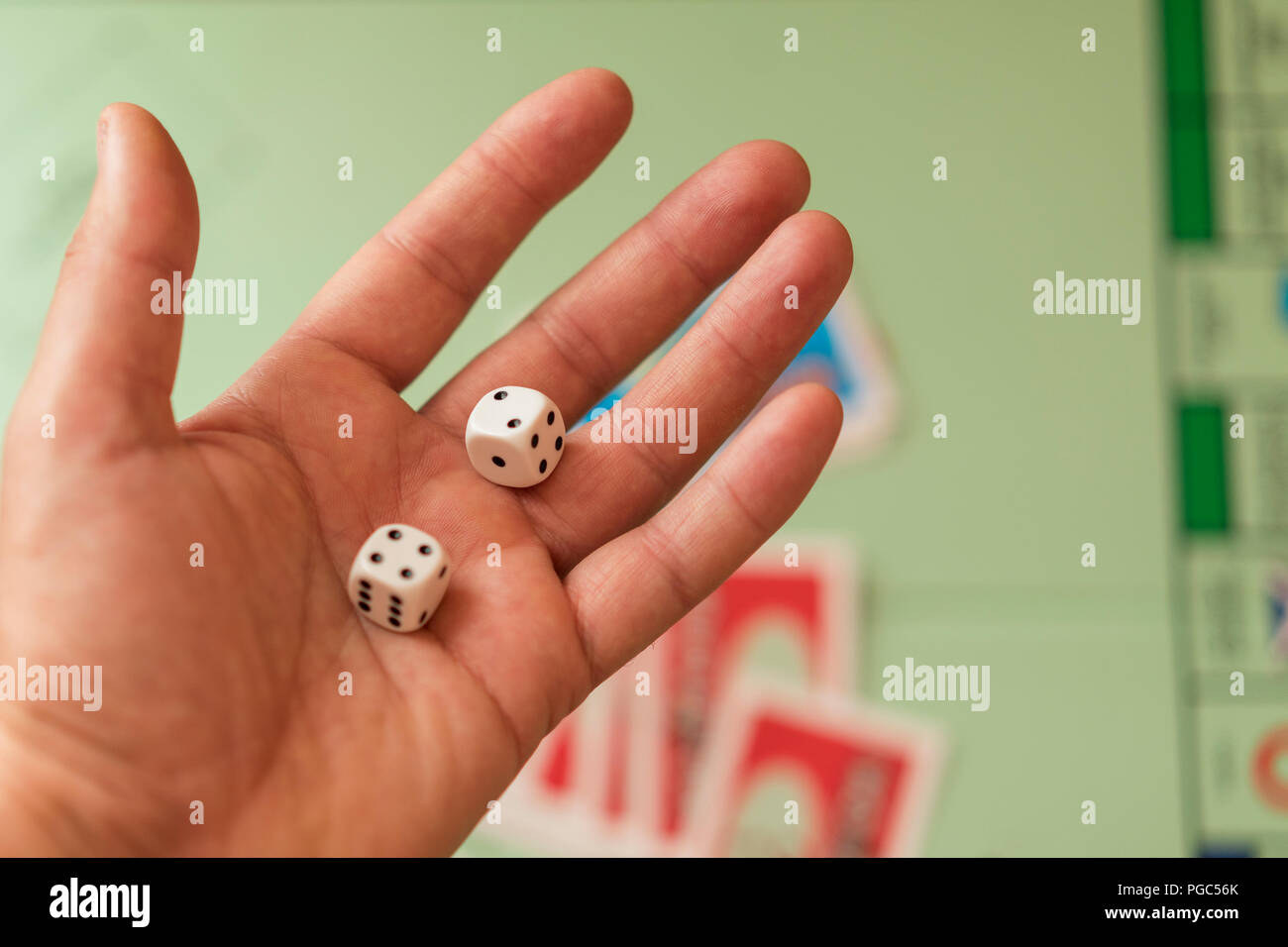 Hand holding red dices hi-res stock photography and images - Alamy