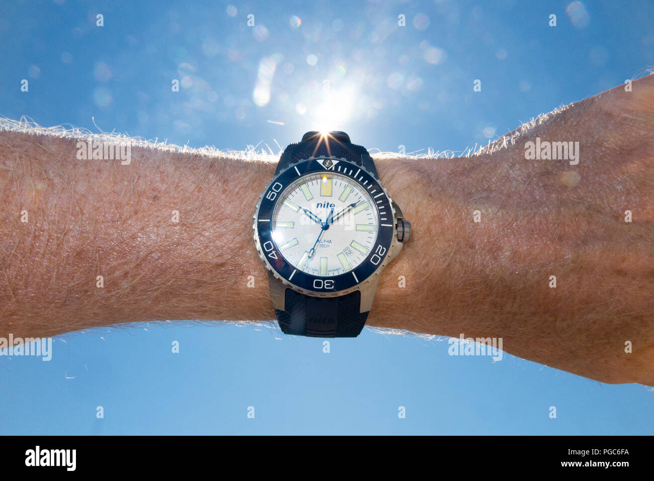 Watch made by British manufacturer Nite watches being worn on a beach ...
