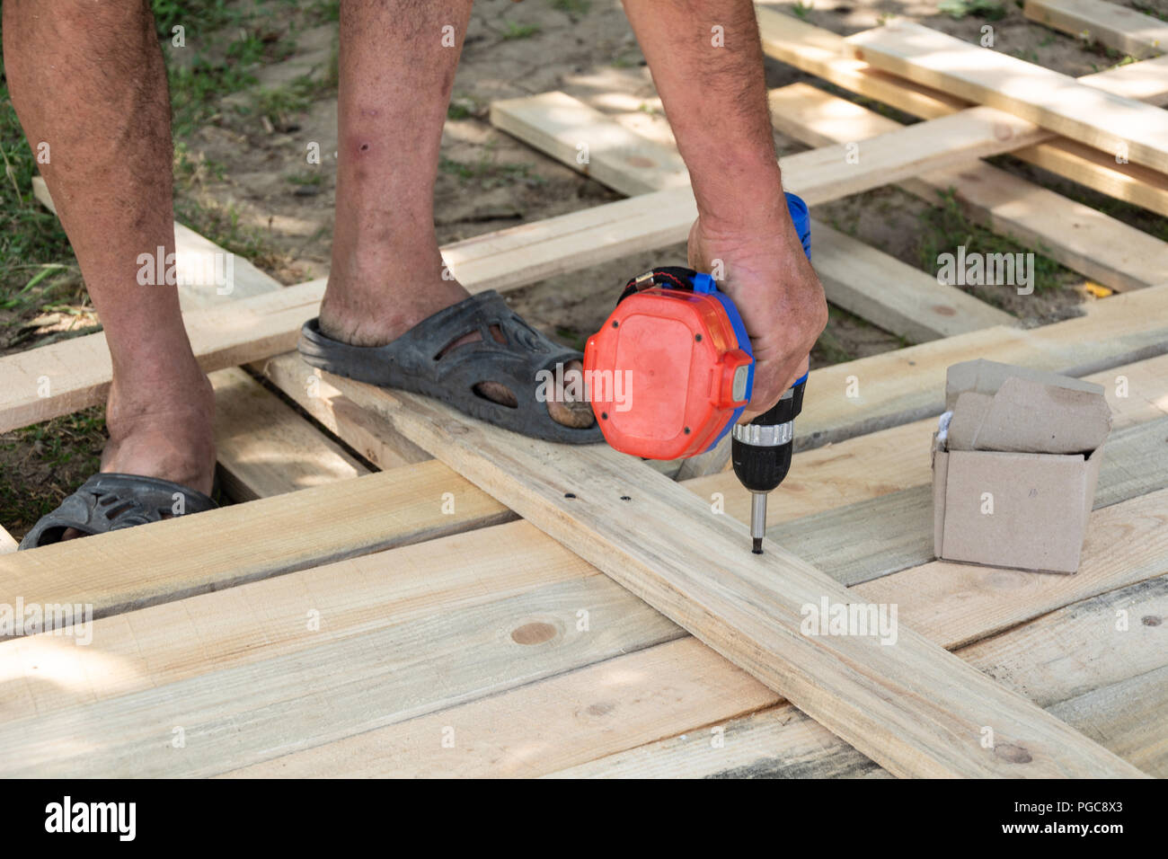 Drill wood workshop. Woodwork and people concept - carpenter with ...