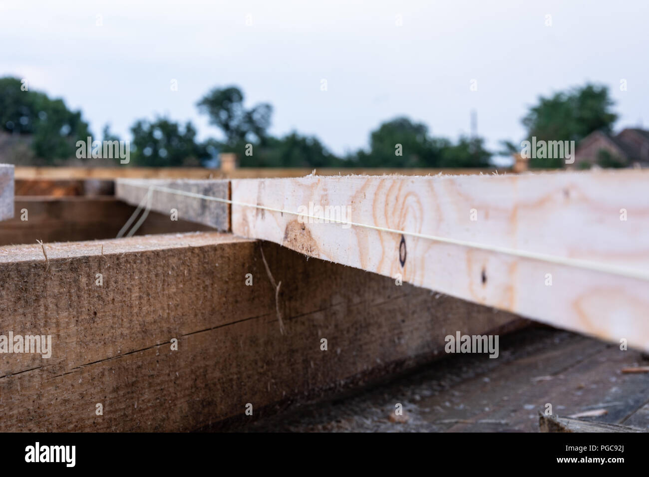 Details of the frame house construction. Alignment of beams, selective ...