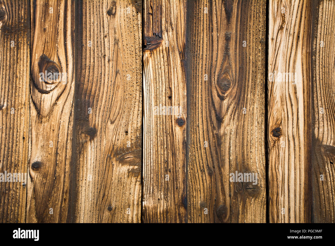 A fragment of an old wooden wall of a building. Background. Texture ...