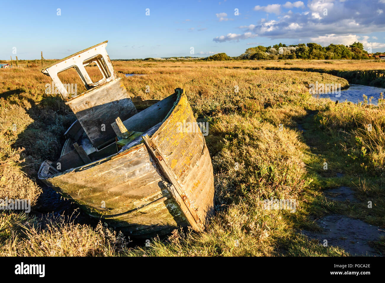 Old boat wreck abandoned in marshland on Norfolk coast, East Anglia ...