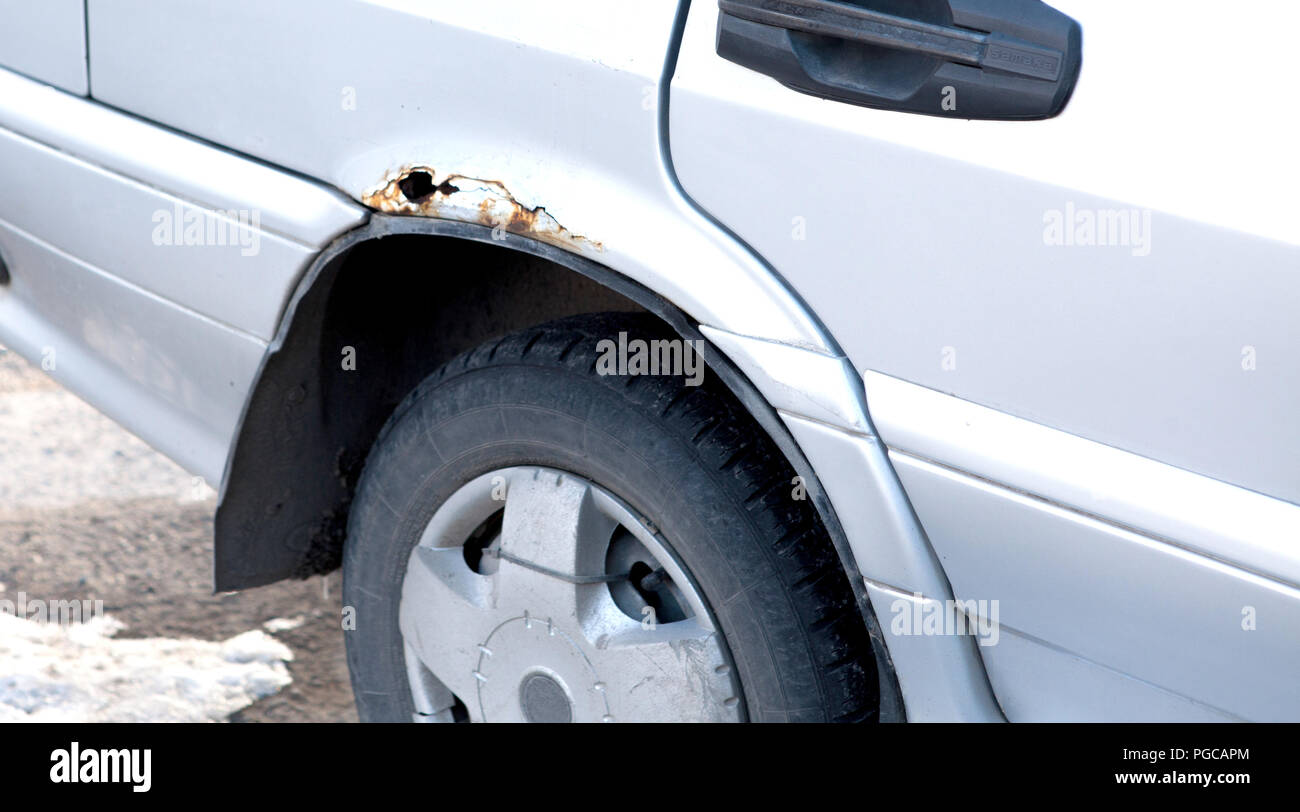 Car with a Hole from Rust and Corrosion Stock Photo - Alamy