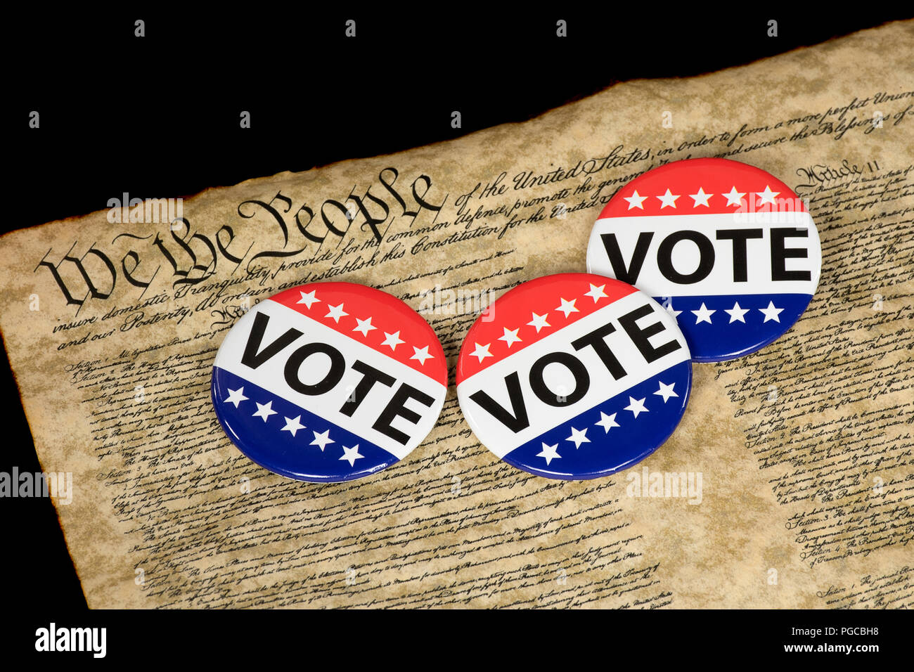 patriotic campaign voting pins on vintage United States Constitution ...