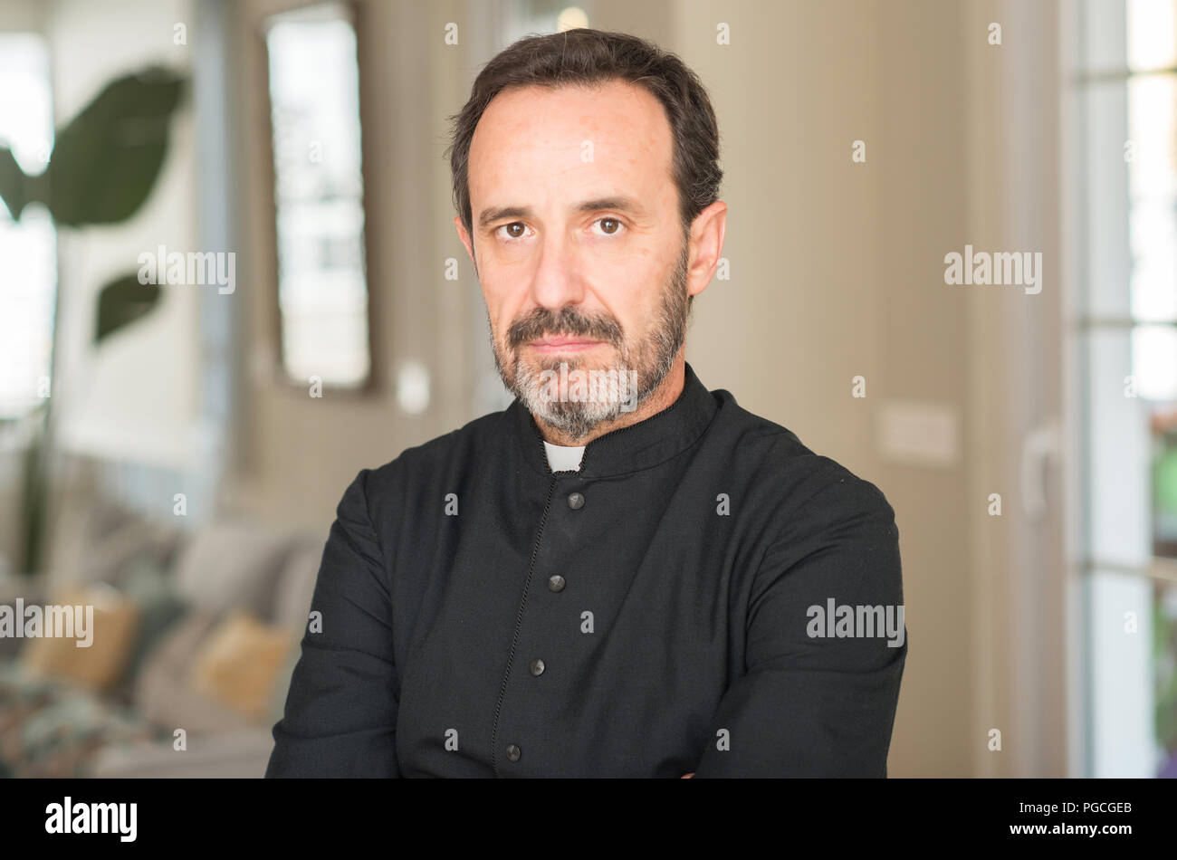 Christian priest man with a confident expression on smart face thinking ...