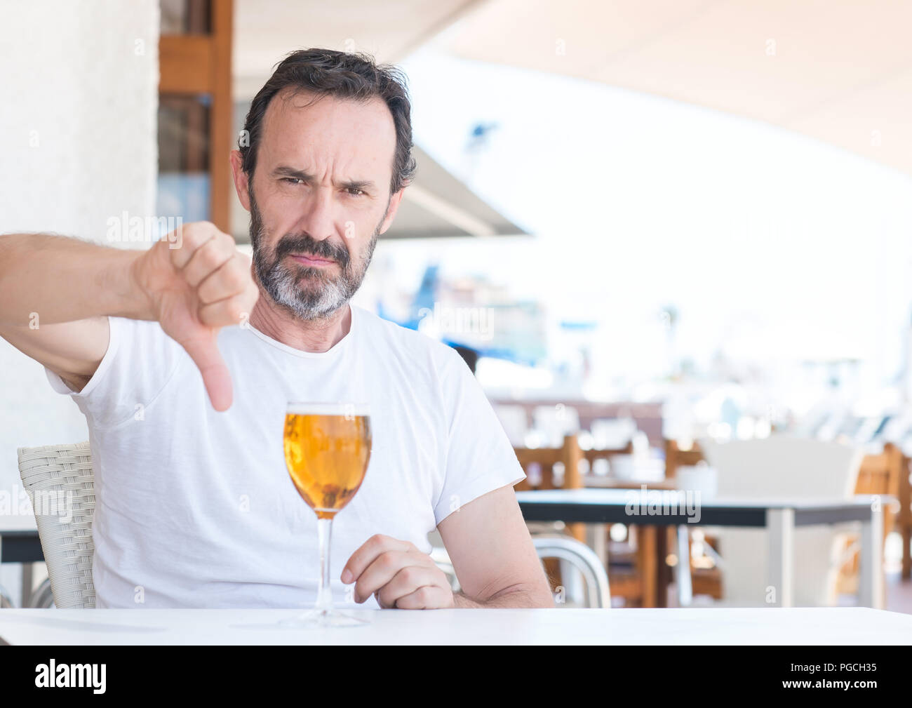 Angry sad man drinking beer hi-res stock photography and images - Alamy
