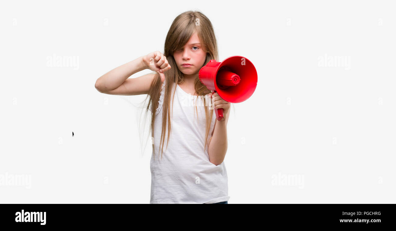 Young blonde toddler holding megaphone with angry face, negative sign ...