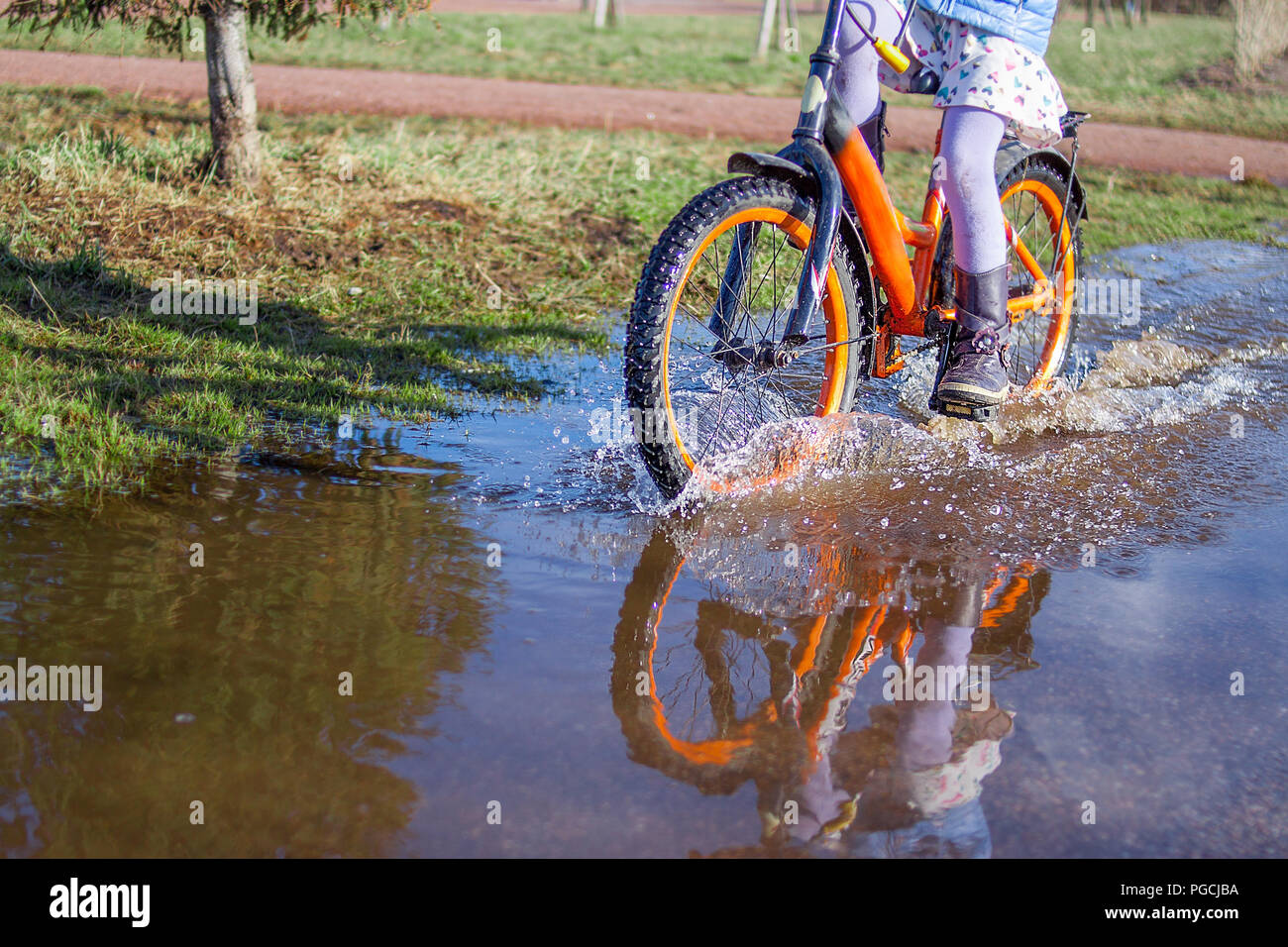 Children bike rain hi-res stock photography and images - Alamy