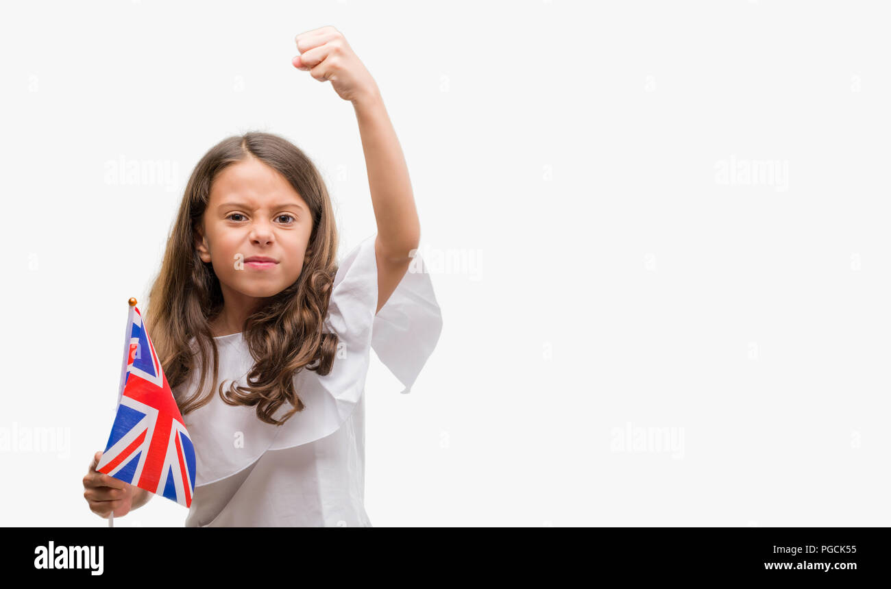Brunette hispanic girl holding flag of United Kingdom annoyed and ...