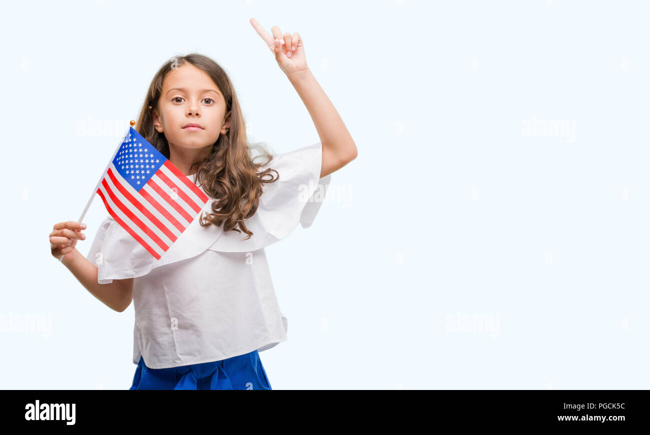 Brunette hispanic girl holding flag of United States of America ...