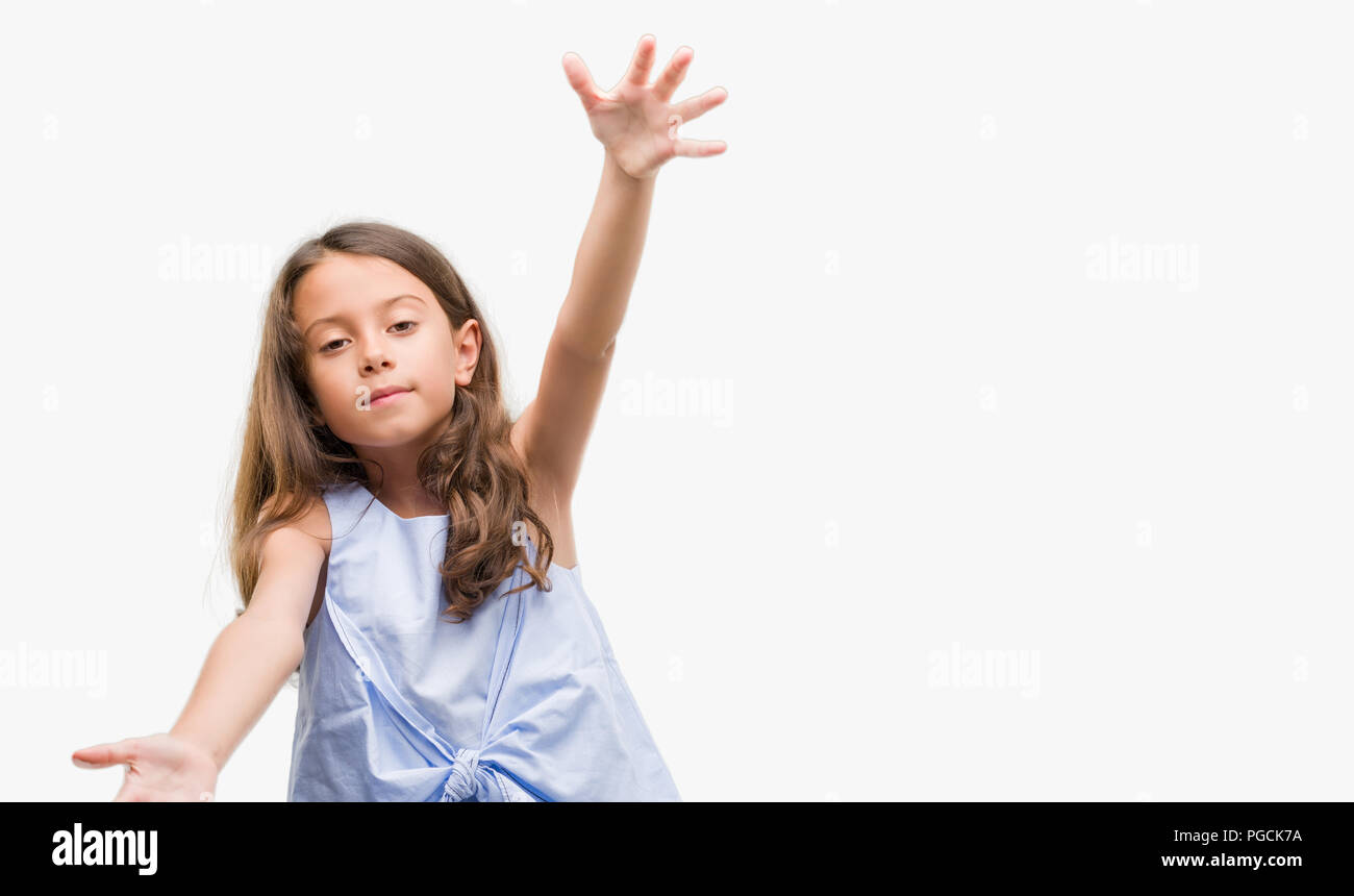 Brunette hispanic girl looking at the camera smiling with open arms for ...