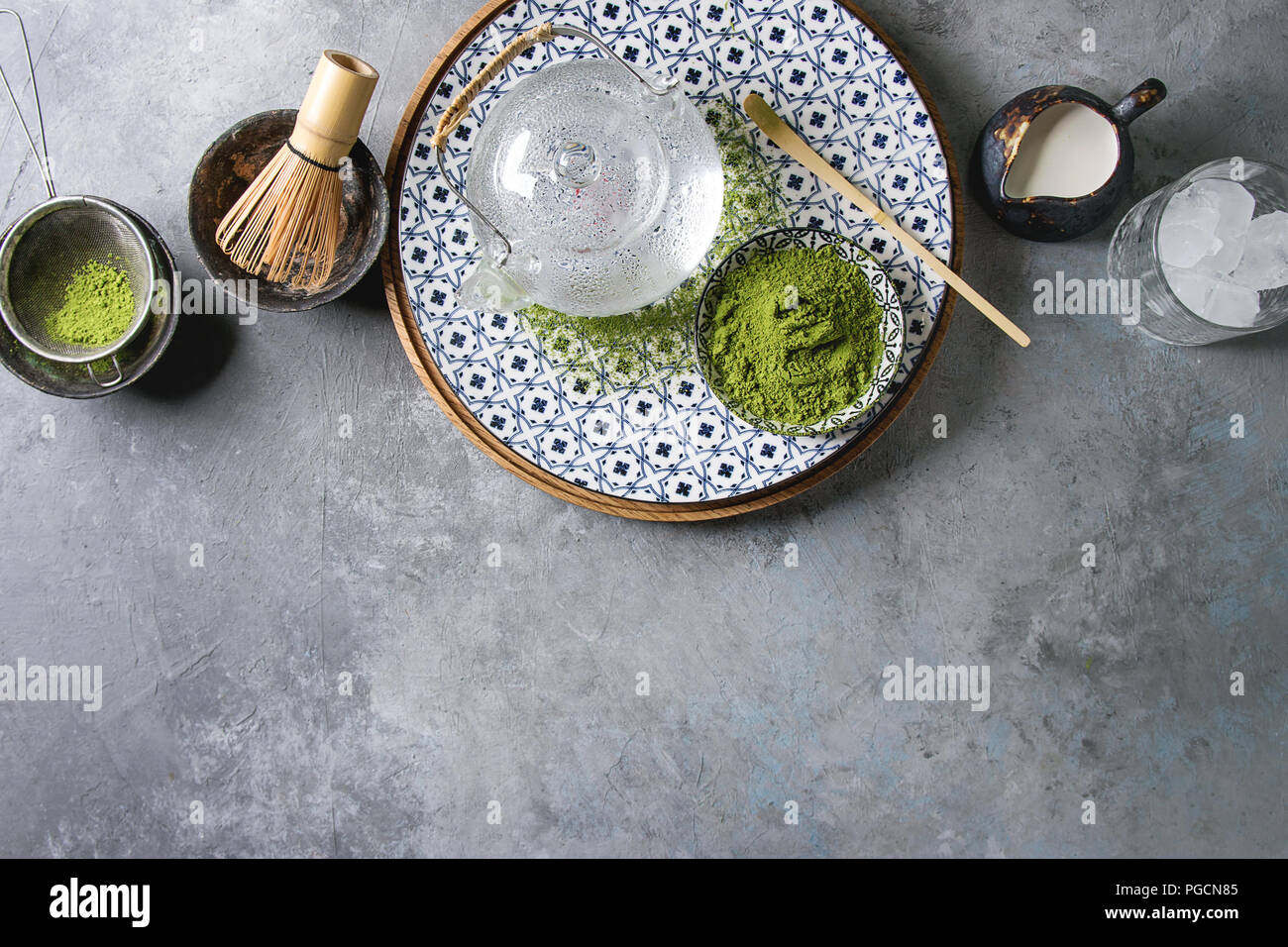 Ingredients for making matcha ice drink. Green tea matcha powder in ...