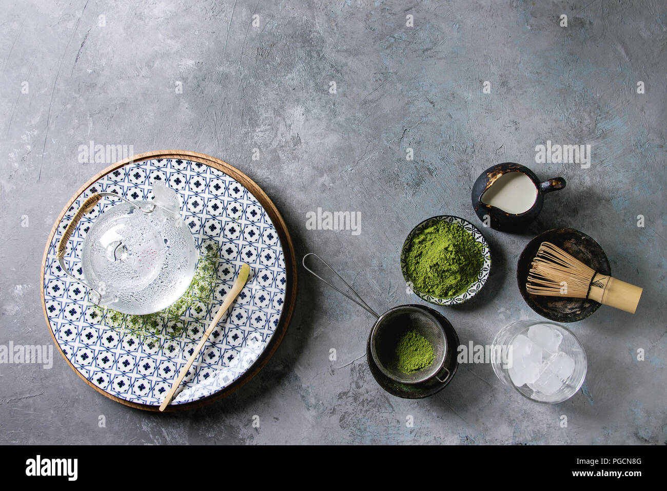 Ingredients for making matcha ice drink. Green tea matcha powder in ...