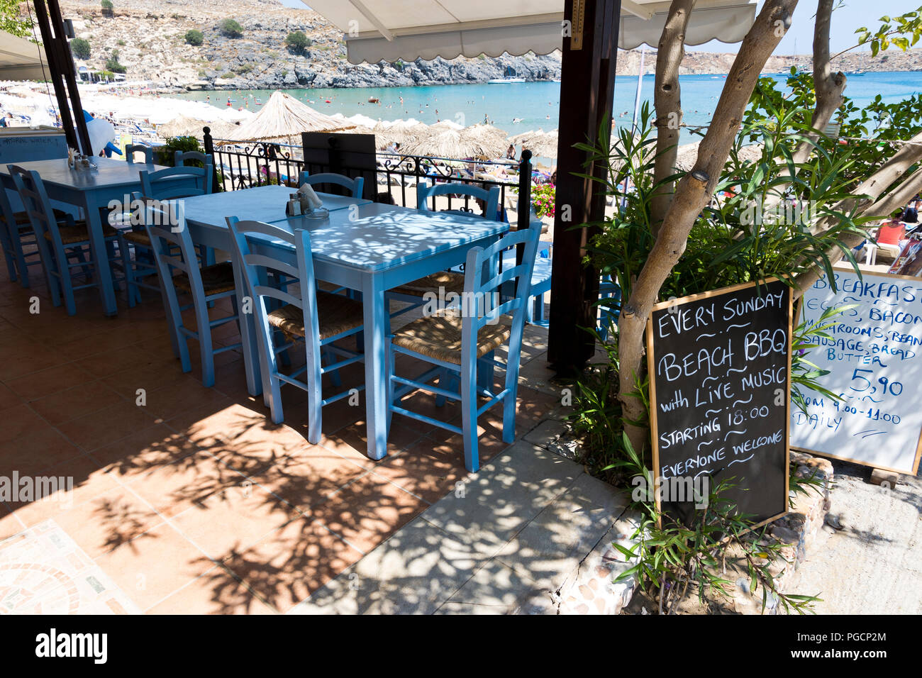 Greek restaurant by the beach, Lindos on the island of Rhodes Stock ...