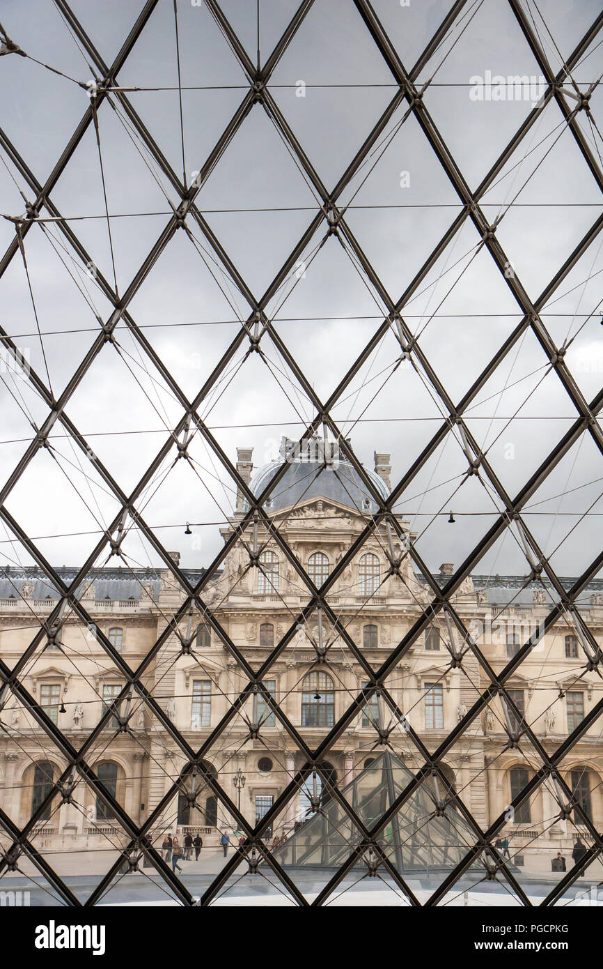 Louvre museum behind windows, Paris, France Stock Photo - Alamy