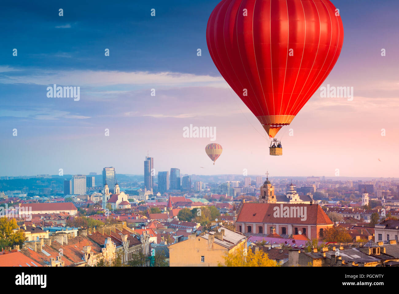 Hot air balloons flying over Vilnius Stock Photo - Alamy