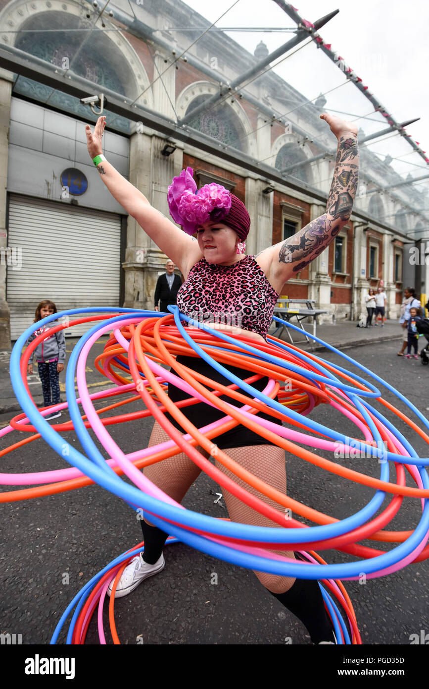 London, UK. 25 August 2018. Members of Marawa's Majorettes, a hula hoop ...