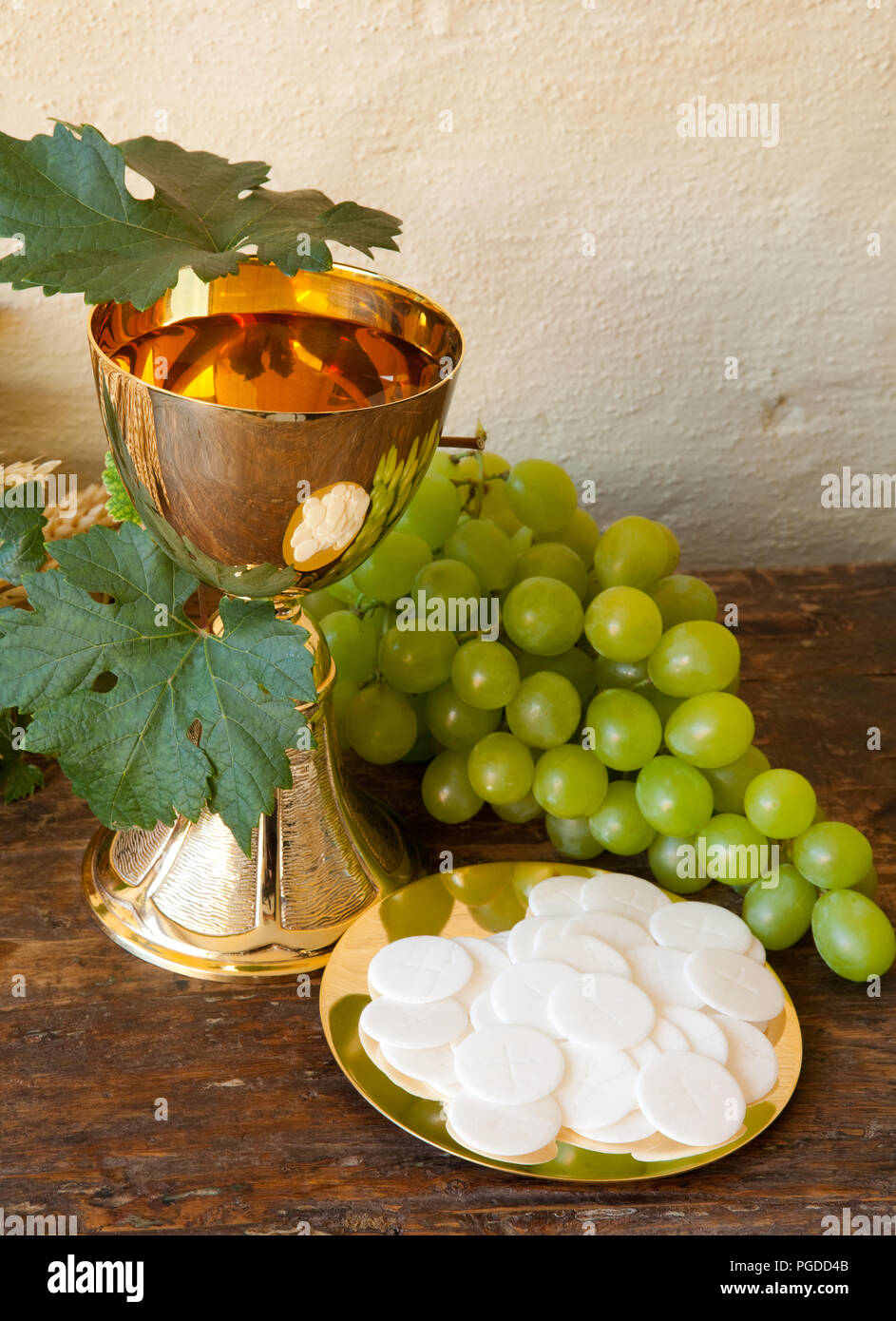 Holy communion image showing a golden chalice with grapes and bread ...
