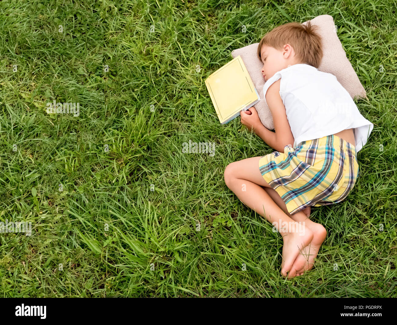 Boy sleeping book hi-res stock photography and images - Alamy
