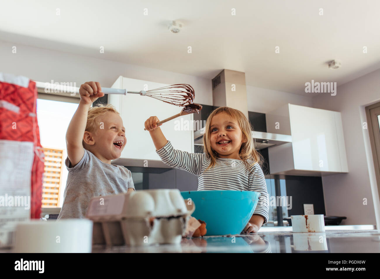 Boy mixing chocolate in kitchen hi-res stock photography and images - Alamy