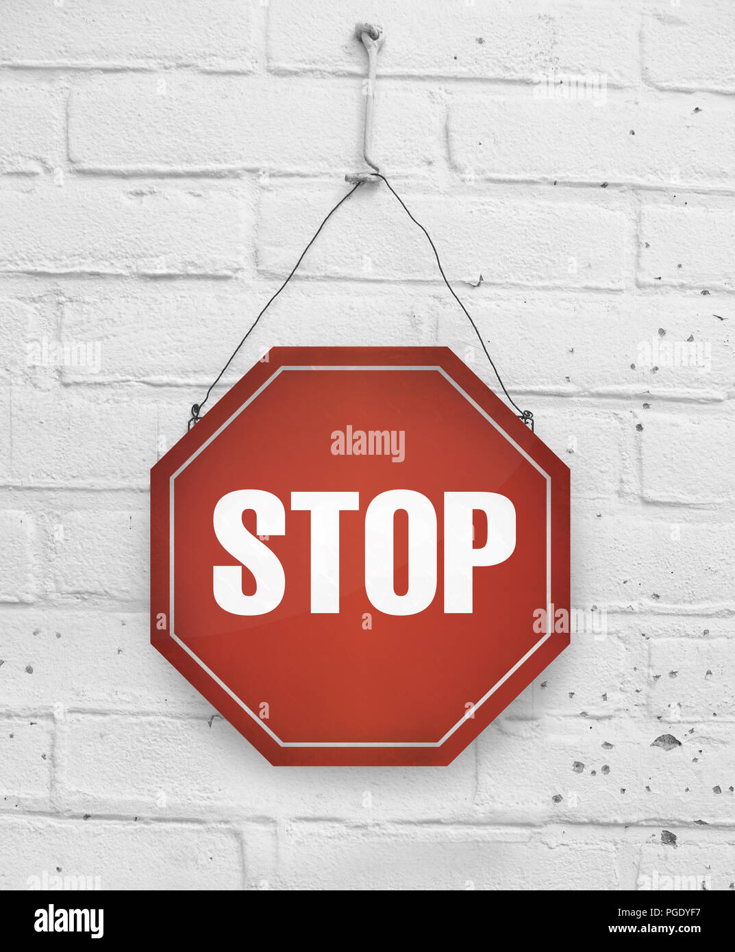 Traffic stop sign metal plate board hanging on white brick background ...