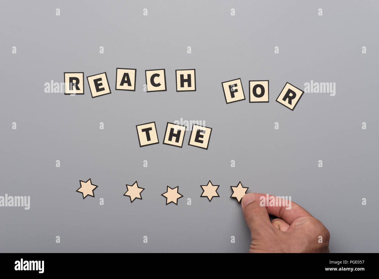 Reach for the stars saying assembled from paper cut letters and stars ...