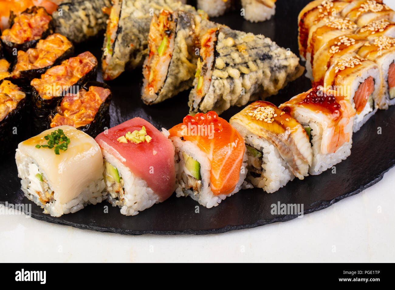 Sushi and rolls mix plate assortment set Stock Photo - Alamy