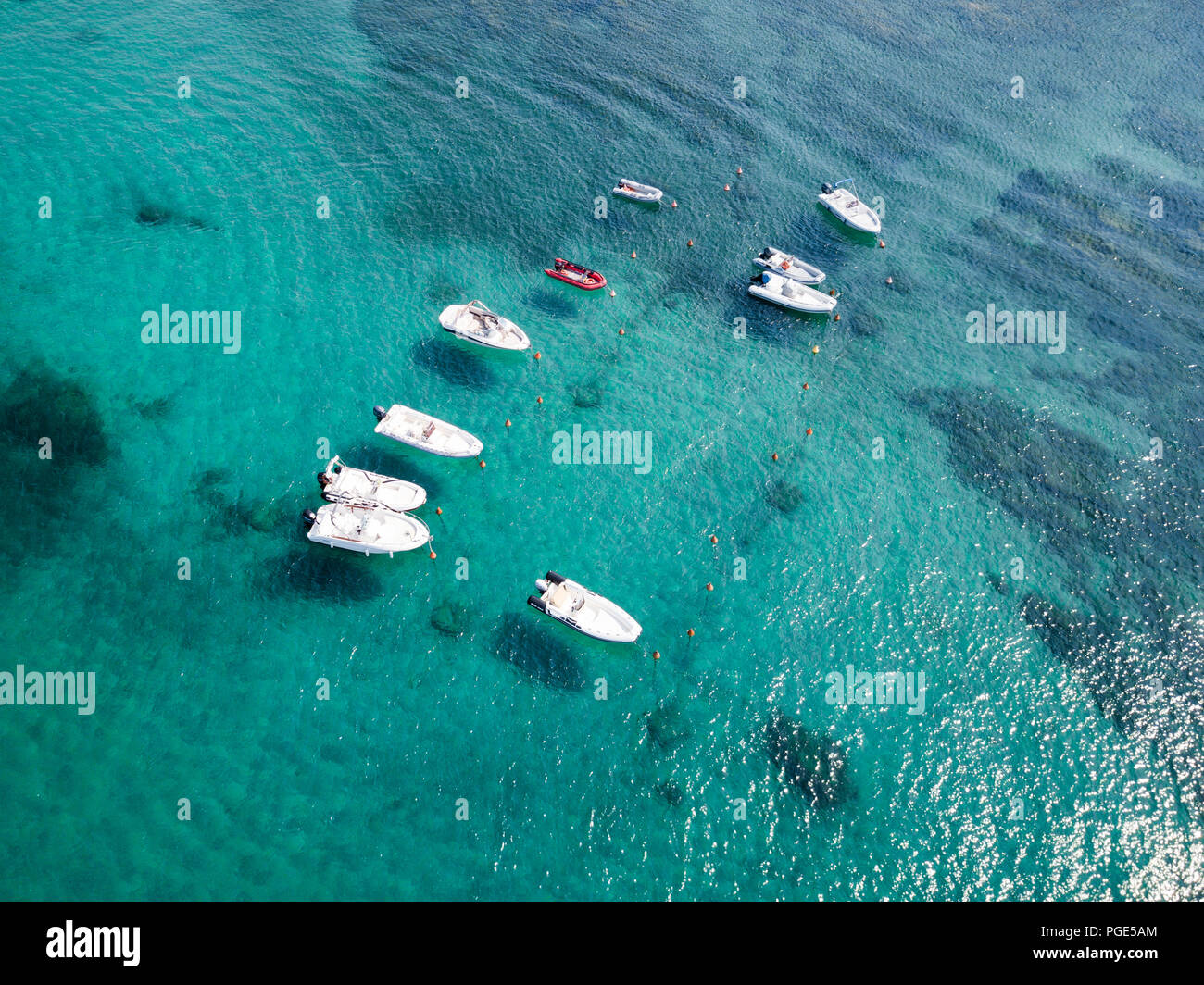 Aerial view of some inflatable boat floating on a beautiful turquoise ...