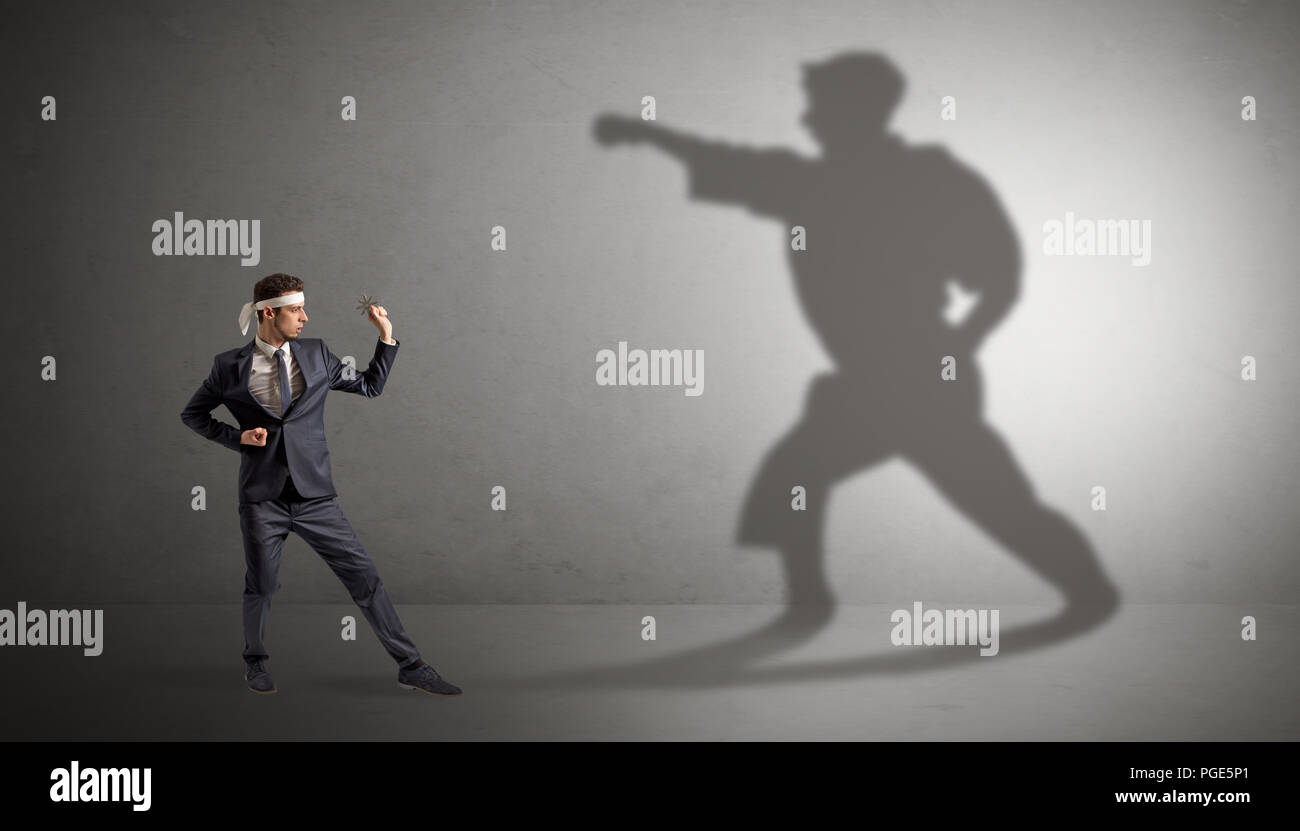 Young karate man confronting with his own shadow Stock Photo - Alamy