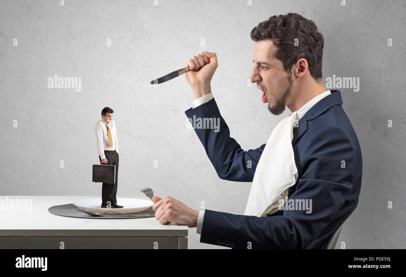 Tiny scared weak businessman almost devoured by great power Stock Photo ...