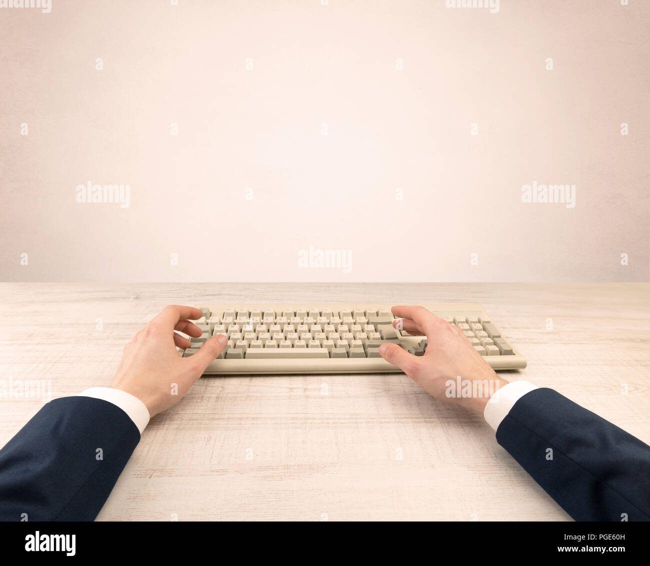 First person view of an elegant businessman hand typing on light ...