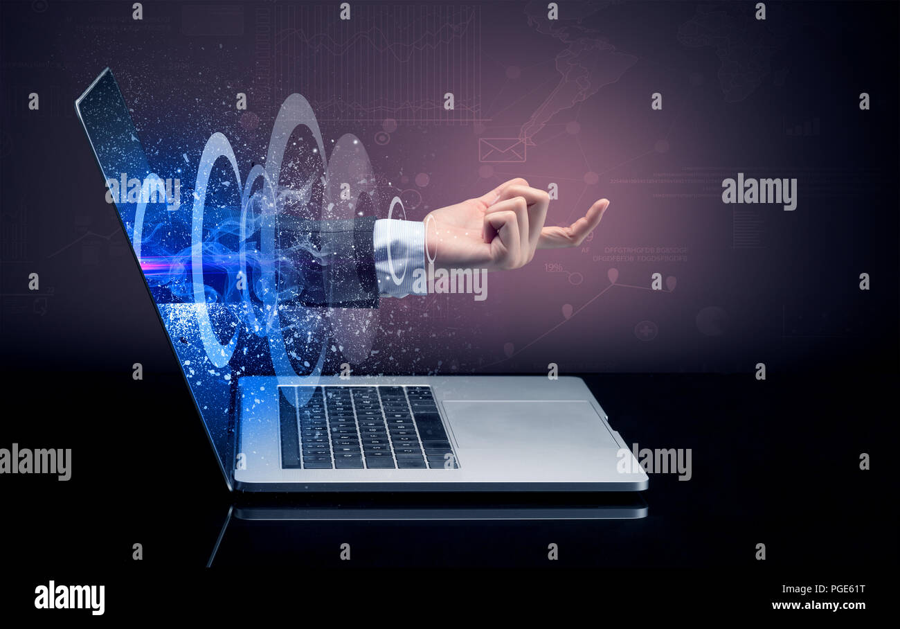 Hand coming out of a laptop with sparkling effects Stock Photo - Alamy