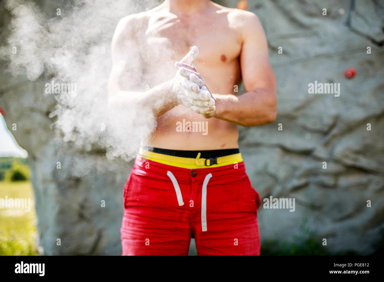 Photo of climber with talc in hands Stock Photo - Alamy