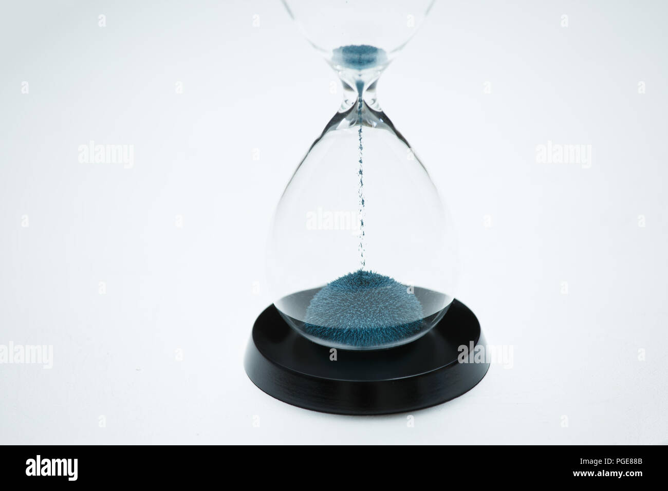 Image of hourglass with blue sand on isolated white background Stock ...