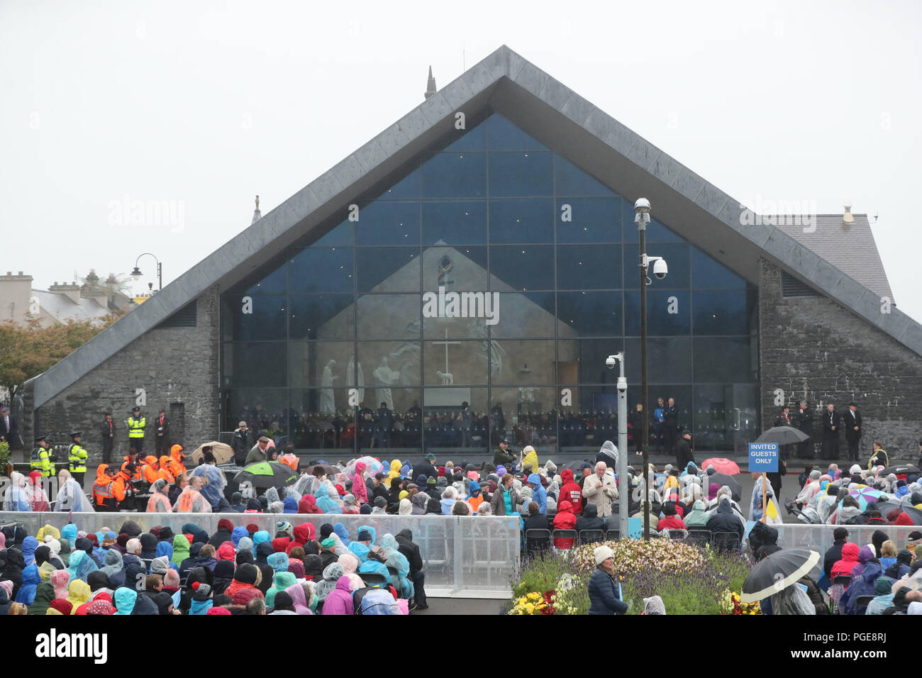 Pilgrims wait for the arrival of Pope Francis at Knock Holy Shrine, in ...