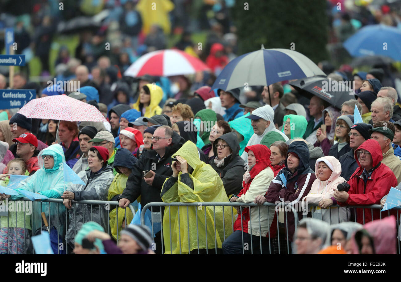 Pilgrims wait for the arrival of Pope Francis at Knock Holy Shrine, in ...