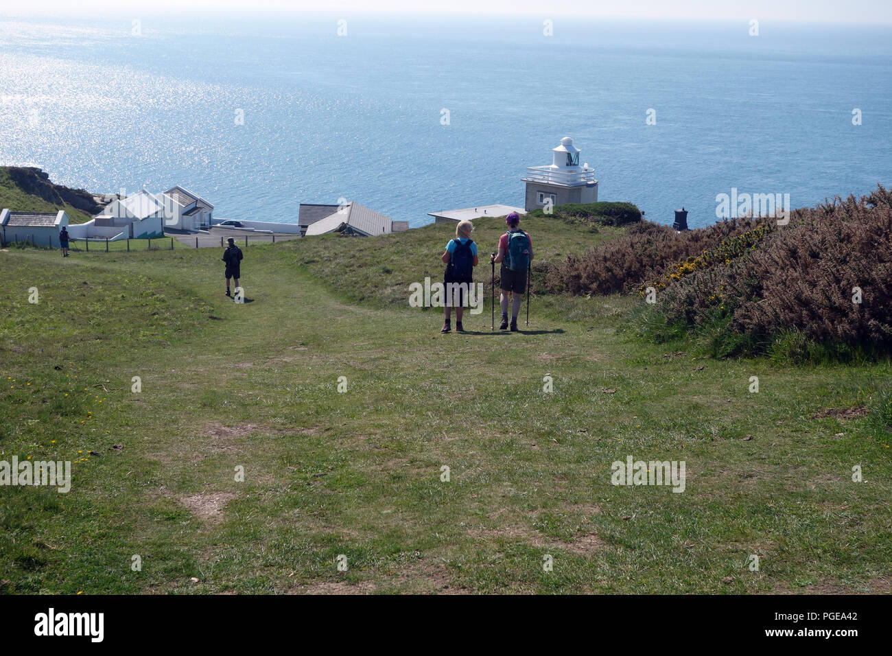 Two Women Walking Towards Bull Point Lighthouse on the South West ...